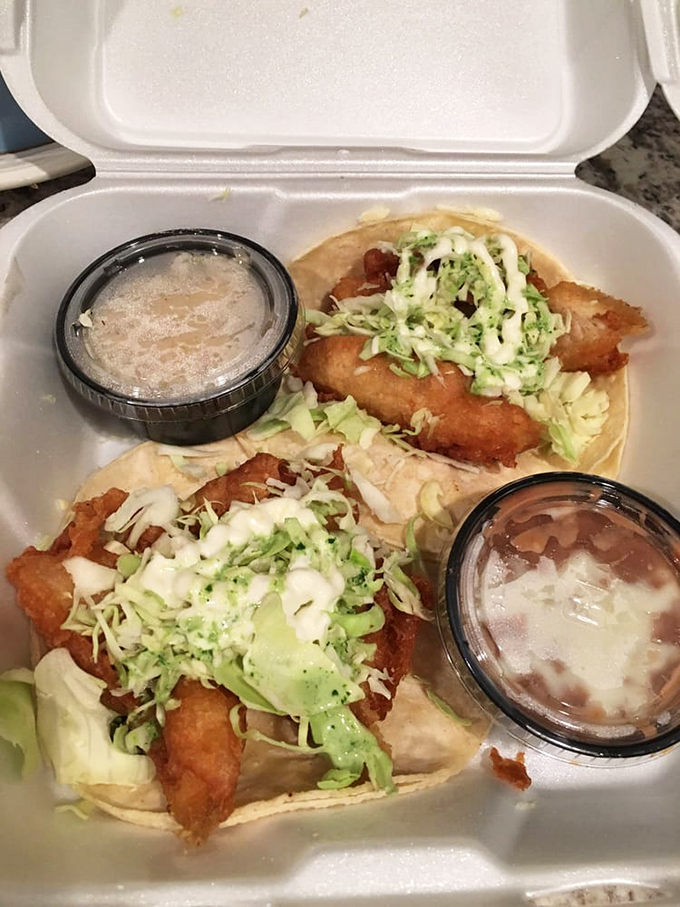 These fish tacos aren't just food—they're an event. Crispy, golden perfection topped with fresh cabbage and creamy sauce that'll haunt your dreams.
