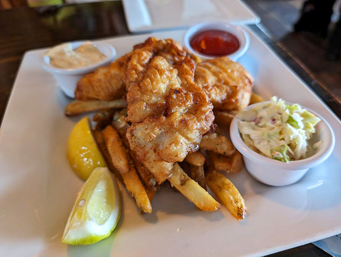 Golden-battered fish and chips that shatter with each bite, paired with hand-cut fries that put ordinary sides to shame. The holy trinity: fish, fries, coleslaw.