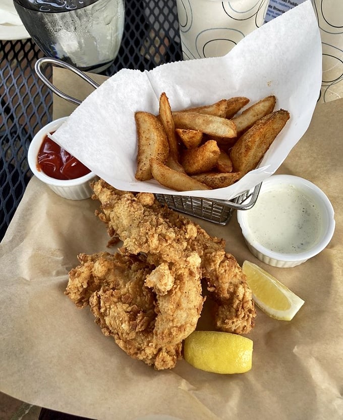 Golden-fried perfection meets potato wedges in this basket of fish and chips&mdash;proof that sometimes the simplest pleasures are the most satisfying.