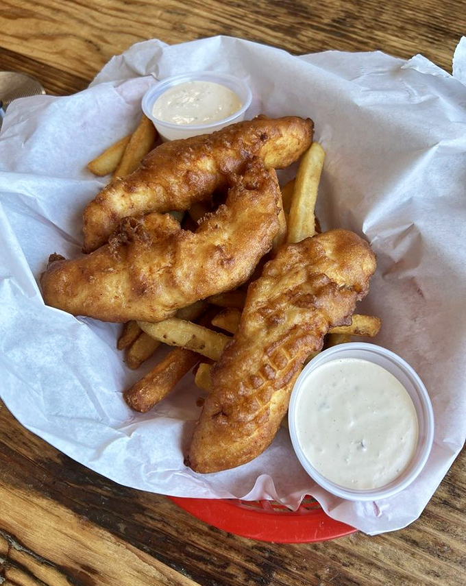 Behold the golden standard: crispy fish that dreams are made of, perfectly paired.