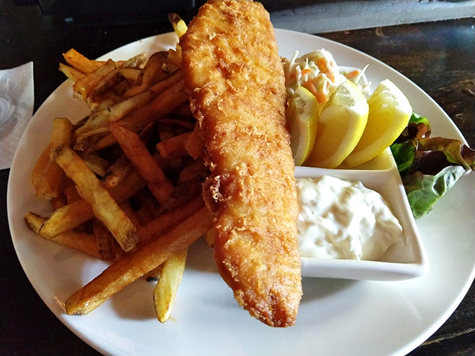 Golden perfection on a plate. This fish and chips achieves the impossible: a shatteringly crisp exterior protecting flaky white fish that would make a British expat weep with joy.