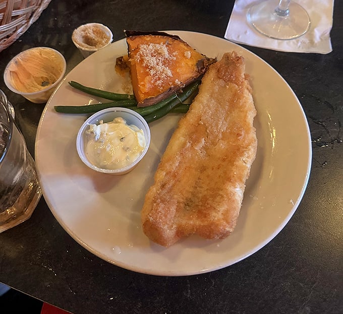 Golden perfection on a plate. This fish fry isn't just dinner&mdash;it's the reason calendars were invented with Fridays.
