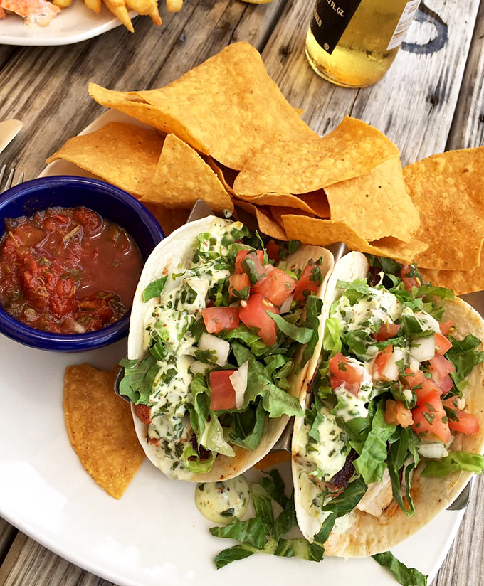 These fish tacos aren't just a meal; they're a beach vacation wrapped in a tortilla, complete with vacation-worthy margarita.