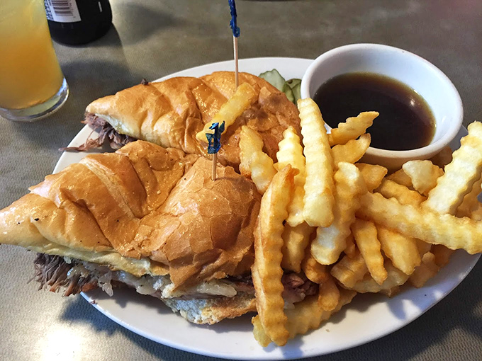 The star of the show: a French dip sandwich that demands a two-handed grip, with au jus so rich it deserves its own retirement plan.