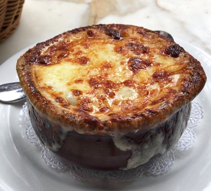 This isn't just French onion soup&mdash;it's a volcanic masterpiece of bubbling cheese concealing a rich, beefy broth that would make Julia Child weep with joy.