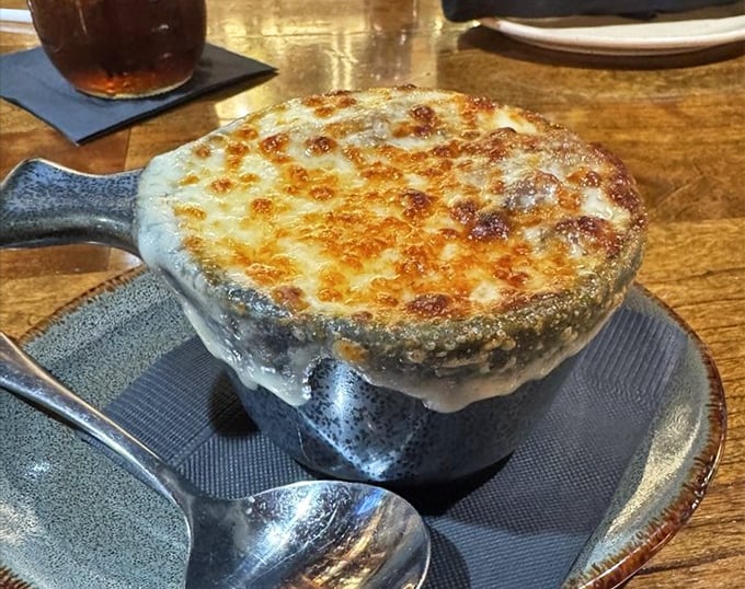This isn't just French onion soup—it's a bubbling cauldron of cheese-crowned comfort that's worth crossing county lines for. Spoon-stretching cheese pulls guaranteed.