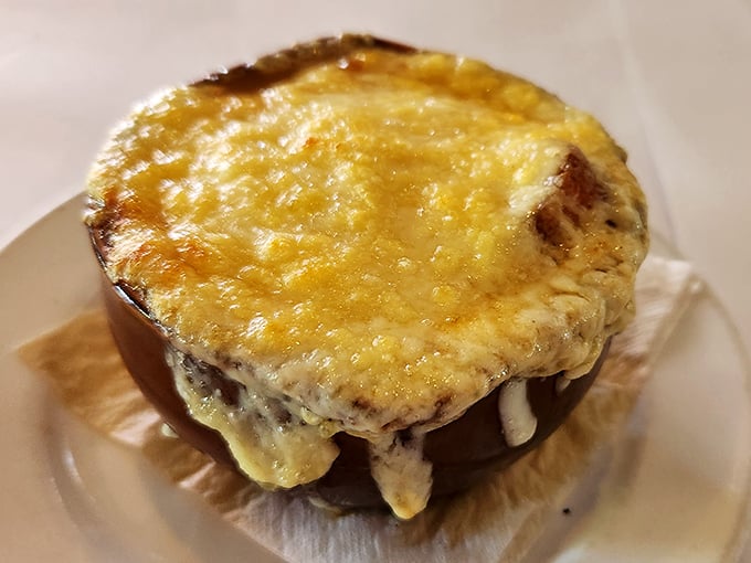 This isn't just French onion soup &ndash; it's a cheese-crowned masterpiece that makes you want to stand up and sing La Marseillaise between spoonfuls.