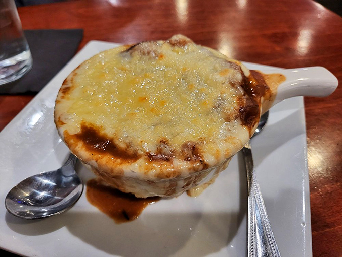 Behold the legendary French onion soup that makes people drive across Pennsylvania &ndash; golden cheese perfection awaits.