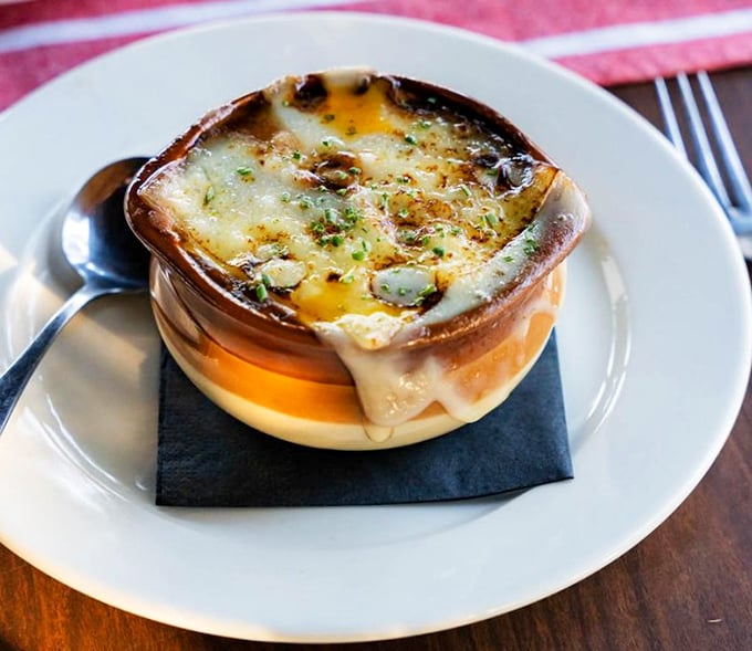 This isn't just French onion soup&mdash;it's a masterpiece of bubbling cheese, rich broth, and bread that's soaked up decades of culinary wisdom.