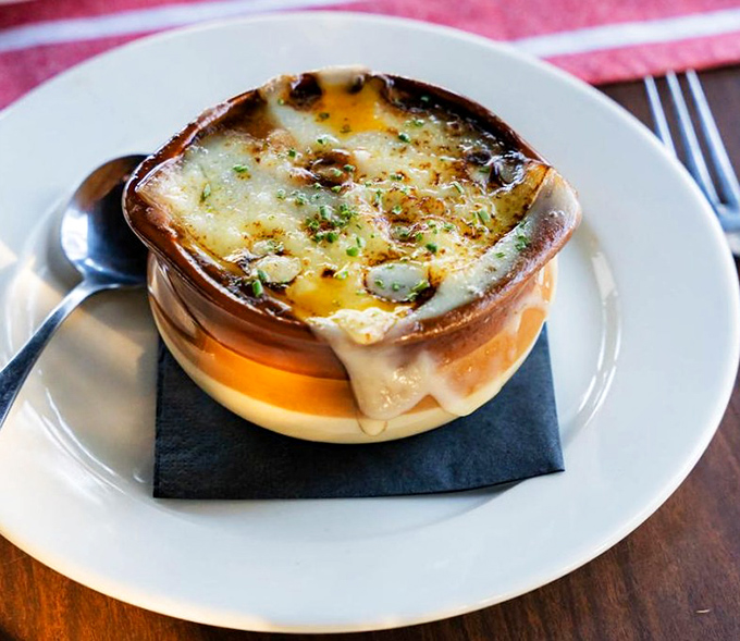 This isn't just French onion soup&mdash;it's a masterpiece of bubbling cheese, rich broth, and bread that's soaked up decades of culinary wisdom.