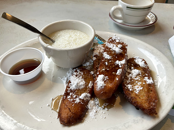 Golden-brown French toast dusted with powdered sugar snow &ndash; this isn't breakfast, it's edible nostalgia that makes you want to hug your plate.
