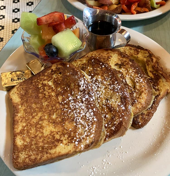 Golden-brown French toast dusted with powdered sugar&mdash;this isn't breakfast, it's edible artwork with a side of fresh fruit.