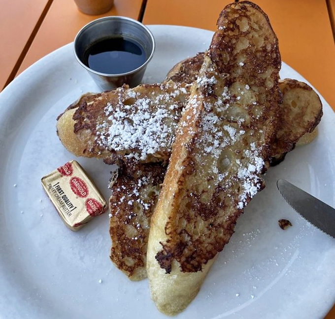 This isn't just French toast&mdash;it's a masterclass in breakfast perfection. Golden, crispy exterior giving way to custardy heaven, dusted with powdered sugar like fresh snow.