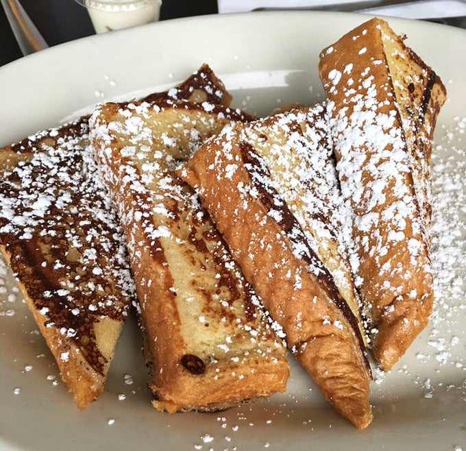 Golden-brown challah French toast dusted with powdered sugar&mdash;proof that sometimes the simplest pleasures are the most transcendent. 