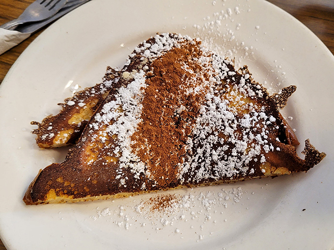 French toast that's achieved the golden-brown perfection we all attempt at home but rarely achieve. Dusted with powdered sugar and cinnamon like edible fairy dust.