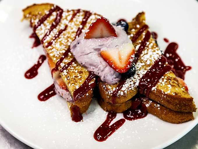 French toast that looks like it's auditioning for a starring role in a food magazine. The berry compote adds that perfect sweet-tart counterpoint.