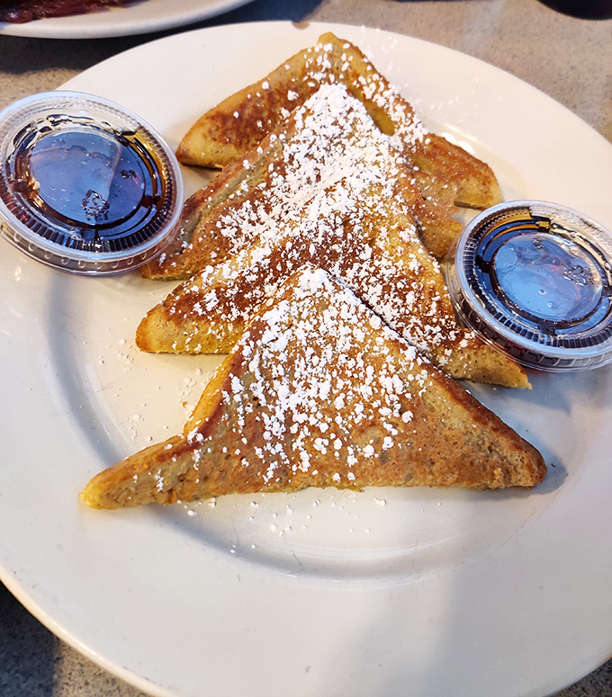 The star of the show: Quinn's French toast dusted with powdered sugar and served with syrup&mdash;simple perfection on a plate.