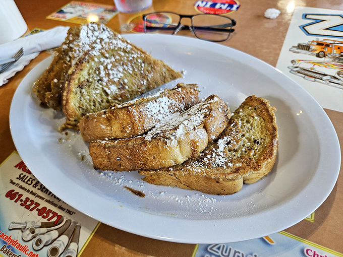 Golden-brown French toast dusted with powdered sugar&mdash;proof that sometimes the simplest pleasures are the ones worth driving across town for.