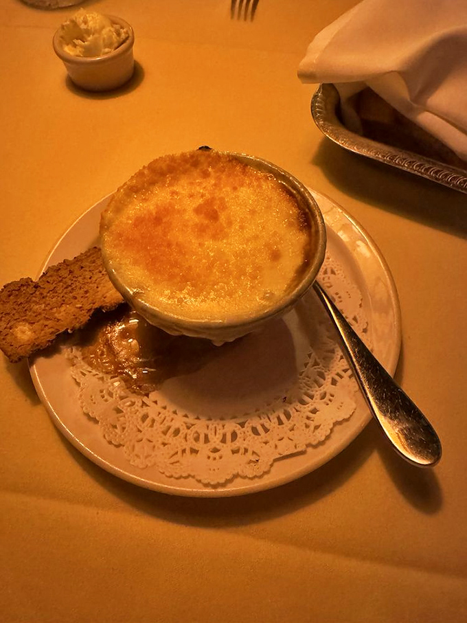 French onion soup done right - bubbling cheese, rich broth, and comfort that warms you from within.