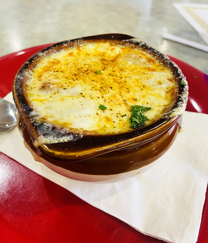 French onion soup that's achieved the holy grail: a perfectly browned cheese cap that stretches dramatically with each spoonful.