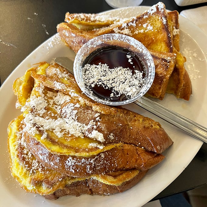 French toast that makes you question why you ever settled for lesser versions—golden, crispy exterior hiding that perfect custardy center.