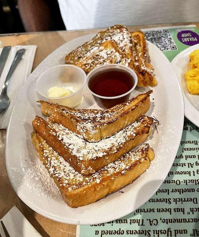 This French toast isn't just breakfast&mdash;it's an event. Golden-brown perfection dusted with powdered sugar, served with real maple syrup and a side of morning bliss.