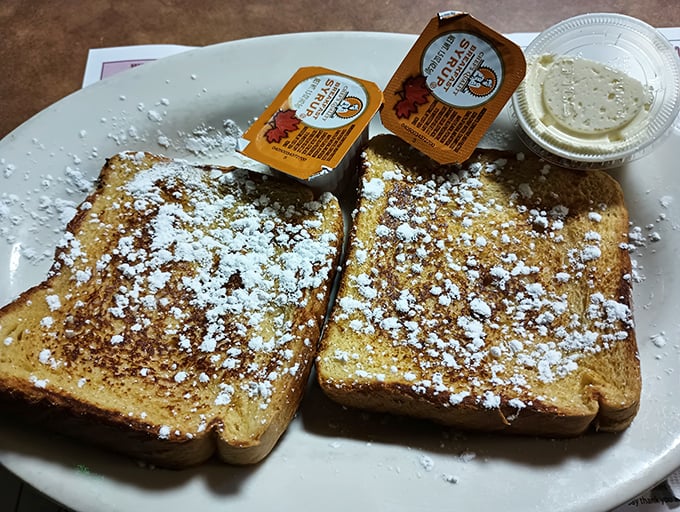 Behold the French toast in all its glory &ndash; dusted with powdered sugar and waiting for that maple syrup cascade. Breakfast nirvana achieved!