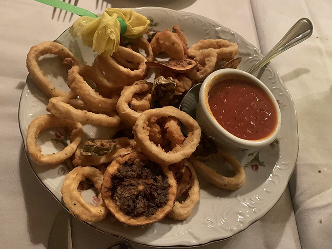 Golden, crispy perfection on a plate. This calamari isn't just fried&mdash;it's transformed into the reason you'll be planning your next visit before finishing your first.