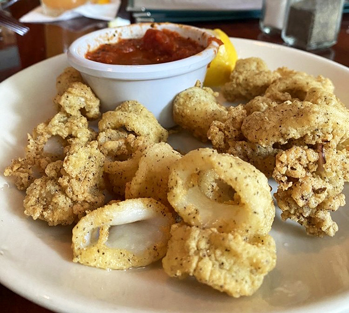 Golden-fried calamari that shatters with each bite &ndash; the holy grail of seafood appetizers. That marinara sauce is just showing off at this point.
