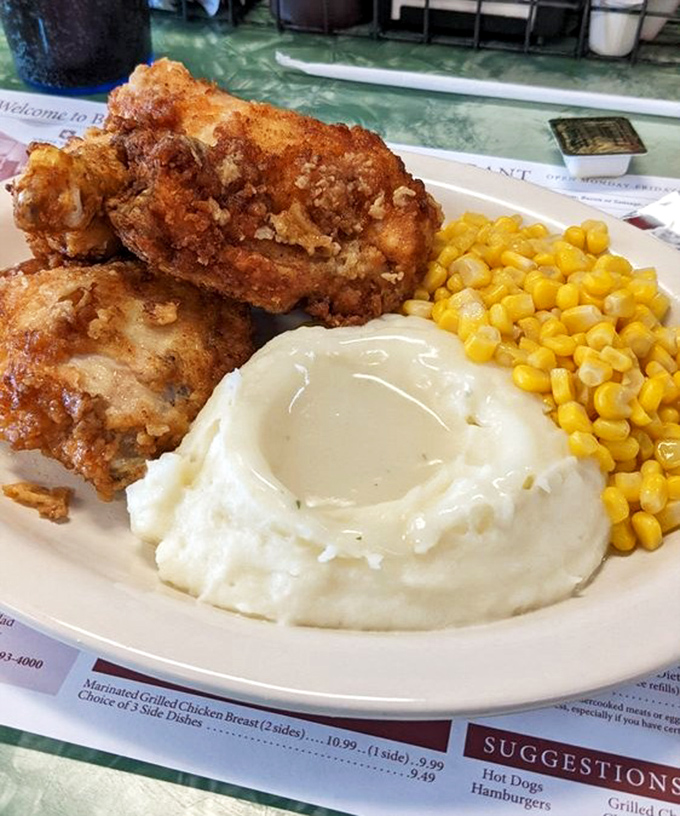 Fried chicken that would make your grandmother both proud and jealous. That golden crust holds secrets only decades of practice can perfect.