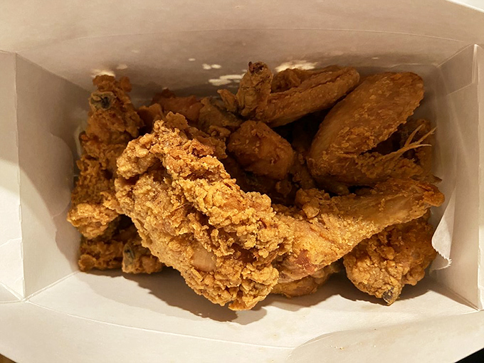 Golden-brown perfection in a takeout box. This isn't just fried chicken &ndash; it's edible nostalgia that makes you close your eyes on the first bite.
