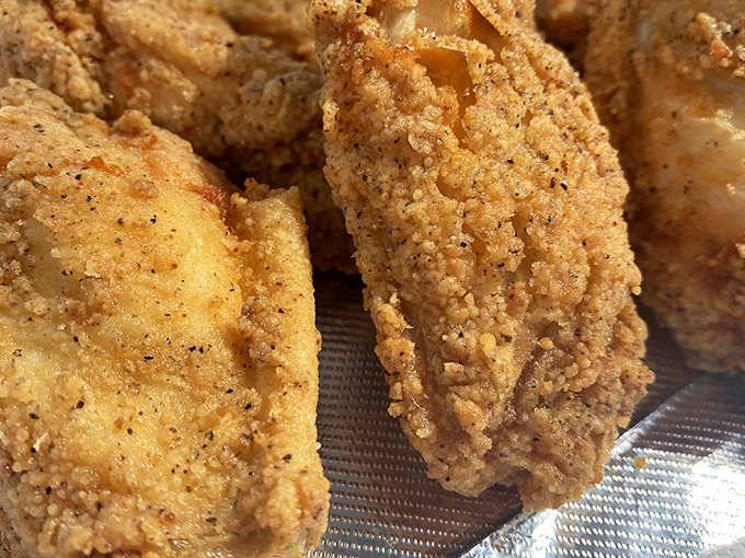 Golden-brown perfection that shatters with each bite &ndash; this isn't just fried chicken, it's edible sunshine with a crispy crust.