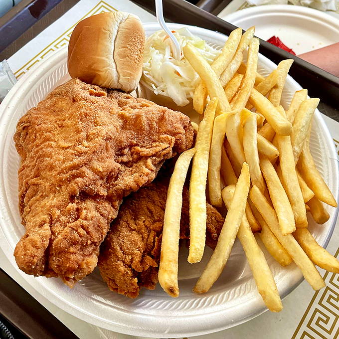 Golden-fried perfection on a plate! This crispy chicken alongside those picture-perfect fries is the comfort food equivalent of a warm hug from your favorite aunt.