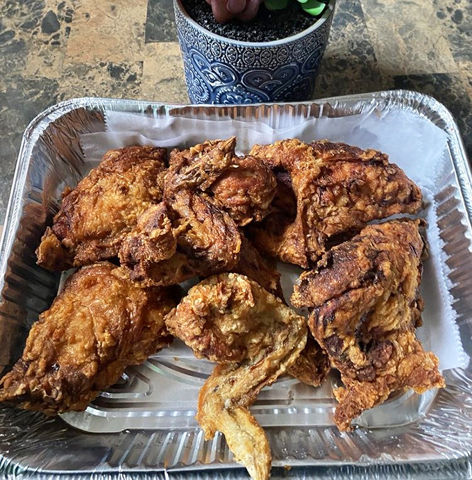 Golden-brown perfection that makes you want to high-five the chef. This fried chicken's crackling skin gives way to juicy meat that would make Colonel Sanders weep with envy.