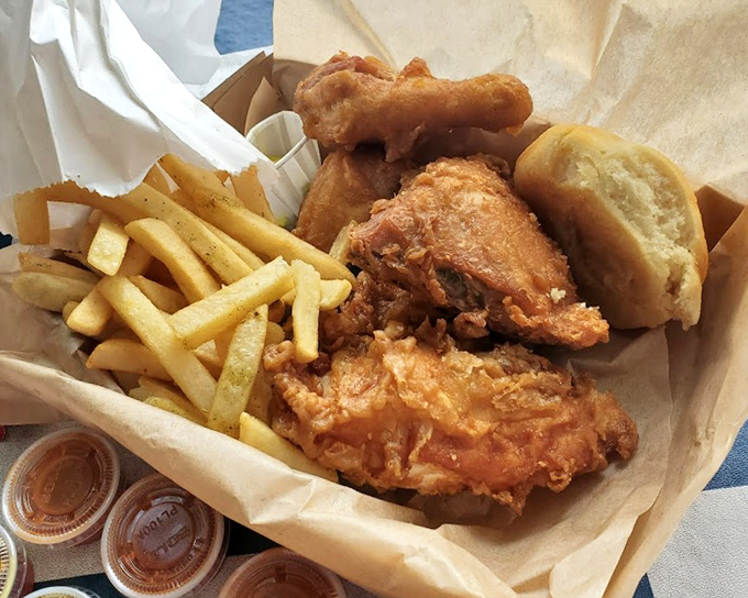 Golden-brown perfection nestled alongside crispy fries and a pillowy biscuit. This basket of joy is what food dreams are made of.