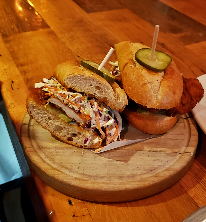 Two sandwiches that could end arguments: coleslaw-topped perfection on one side, pickle-crowned crispiness on the other. Diplomacy never tasted so good.