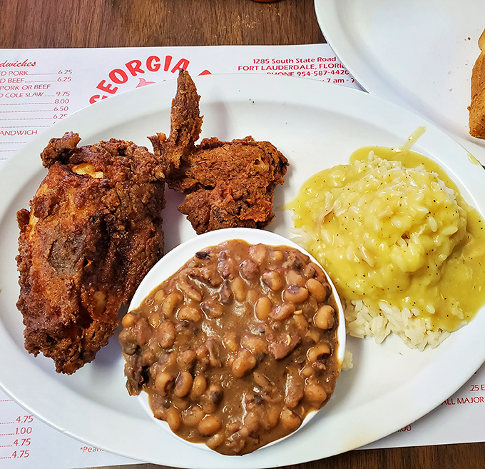 Fried chicken so perfectly golden it belongs in Fort Knox. The mac and cheese and baked beans aren't just sides&mdash;they're co-stars.