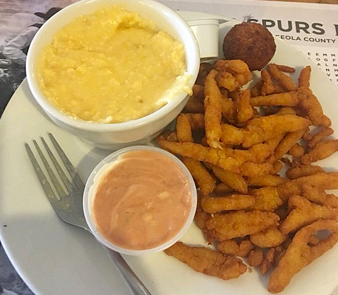 Golden-fried clam strips nestled beside creamy cheese grits and a hush puppy&mdash;a Southern trinity that could make even the most devoted health nut temporarily abandon their principles.