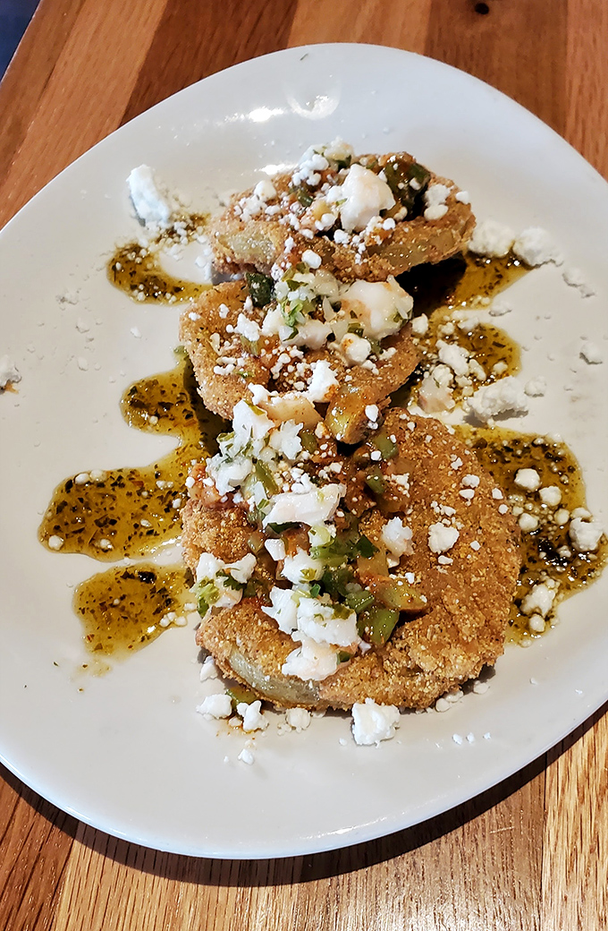 These aren't just fried green tomatoes&mdash;they're edible Southern postcards, complete with crumbled cheese and a sauce worth bottling.