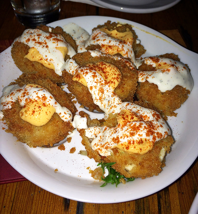 These aren't just fried green tomatoes &ndash; they're crispy cornmeal-crusted discs of joy topped with two sauces that'll make you question all other appetizers.
