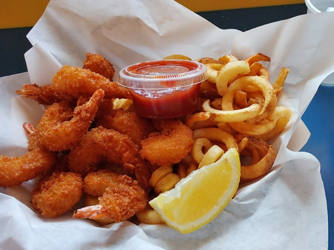 Golden-fried shrimp that snap between your teeth, paired with curly fries that somehow never go limp. The lemon wedge isn't just garnish&mdash;it's essential.