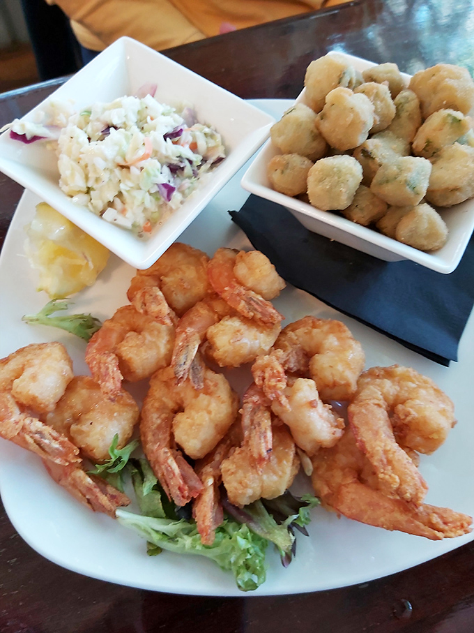 Golden-fried shrimp that snap when you bite them, paired with hush puppies that would make your Southern grandmother weep with joy.