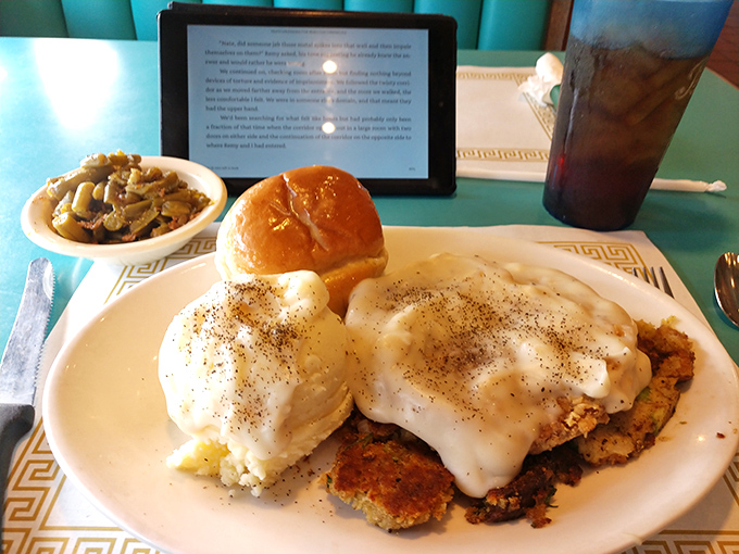 Country fried steak smothered in gravy with a side of green beans&mdash;a plate that whispers "take a nap afterward" but is worth every delicious minute of food coma.