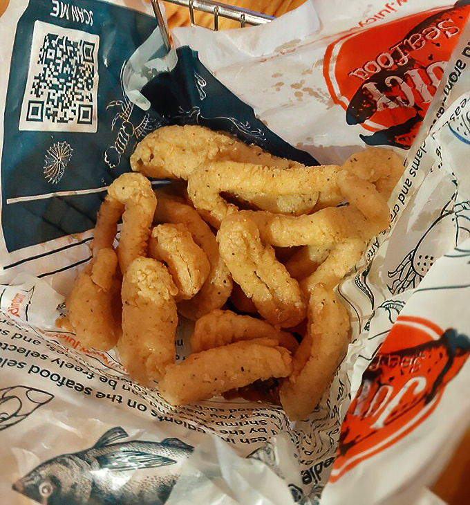 Golden, crispy calamari that doesn't know it's 700 miles from the ocean. Tender, not rubbery—the way the seafood gods intended.