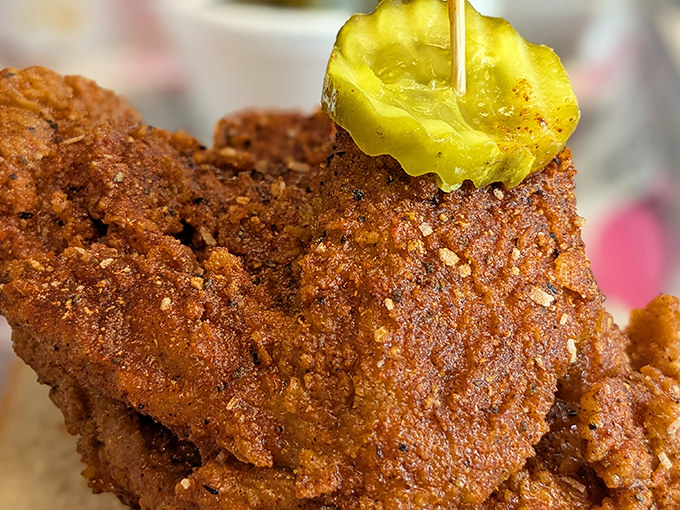That perfect golden-brown crust with a pickle perched on top&mdash;this isn't just fried chicken, it's edible architecture with attitude.