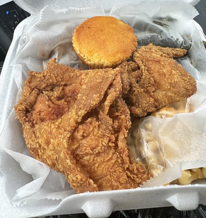 Golden-brown fried chicken with a cornbread sidekick &ndash; this isn't just food, it's edible artwork that crackles with each heavenly bite.
