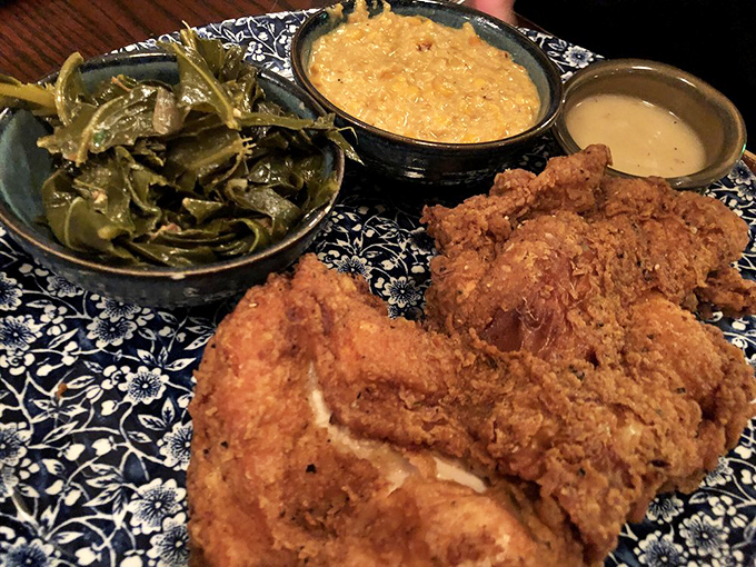 Golden-brown perfection that shatters at first bite, revealing juicy meat beneath. This fried chicken doesn't just speak Southern &ndash; it sings it.