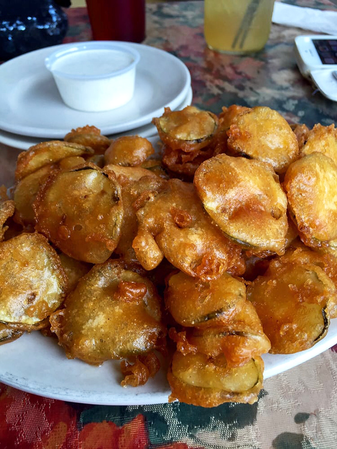 Golden-brown perfection! These fried pickle chips achieve the impossible balance of crispy exterior and tangy interior that pickle skeptics can't resist.
