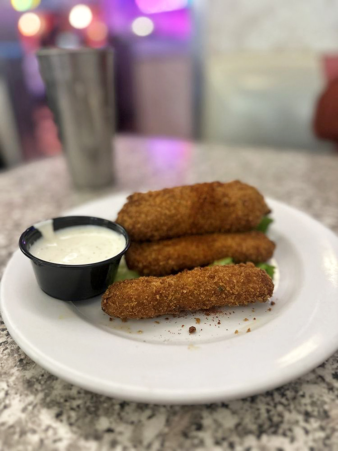 Fried pickles: Because sometimes vegetables need to live a little dangerously too. The perfect tangy counterpoint to all that diner decadence.