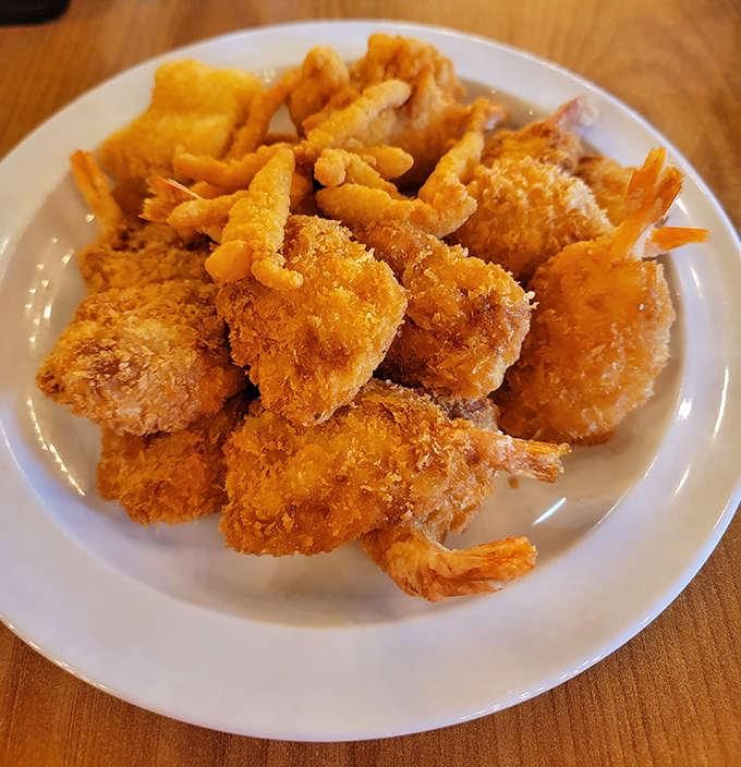 Behold the star attraction! These golden-battered fried shrimp aren't just food&mdash;they're little crustacean miracles that have launched a thousand return trips to the buffet line.
